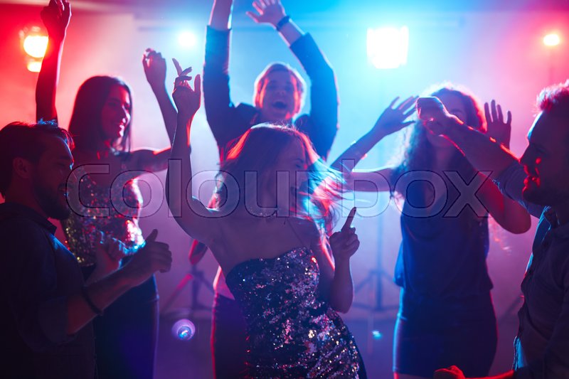 Ecstatic friends enjoying party with ... | Stock image | Colourbox