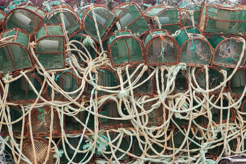 Traps for octopuses stacked in harbor | Stock image | Colourbox