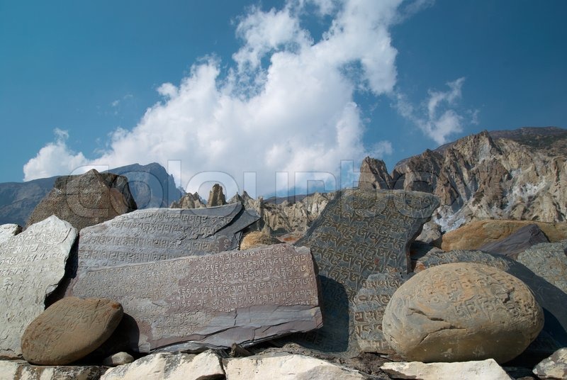 Tibetan prayer stones with mountains and blue sky. Nepal. | Stock Photo ...