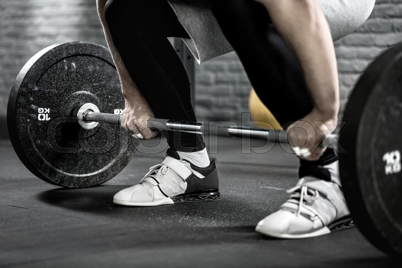 Close-up photo of a barbell and the ... | Stock image | Colourbox