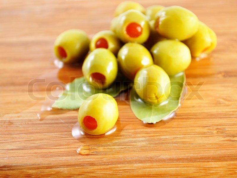 Green olives on a cutting board , close ... | Stock image | Colourbox