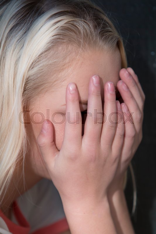 Sad girl left alone | Stock image | Colourbox
