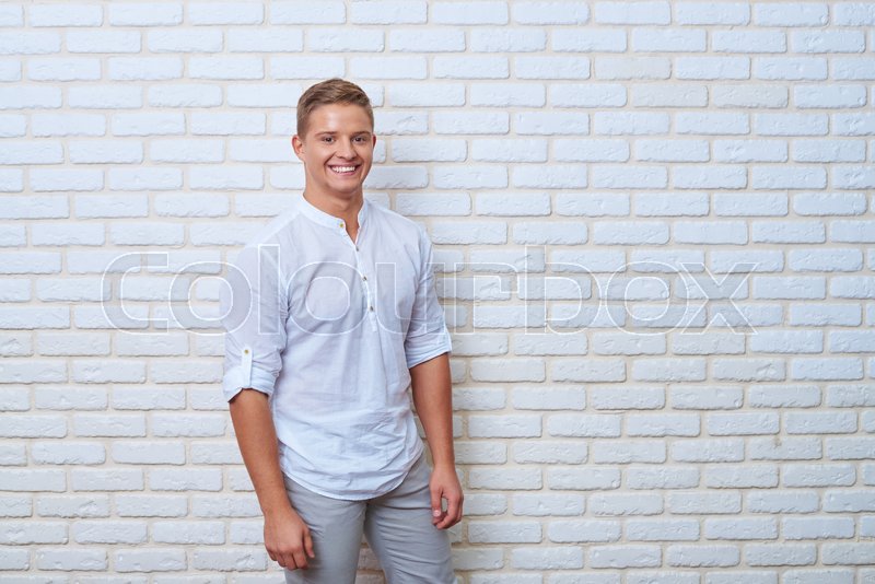 Portrait of relaxed handsome young man ... | Stock image | Colourbox