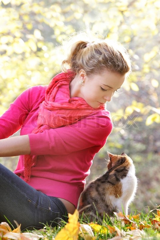 Young attractive girl with cat on ... | Stock image | Colourbox