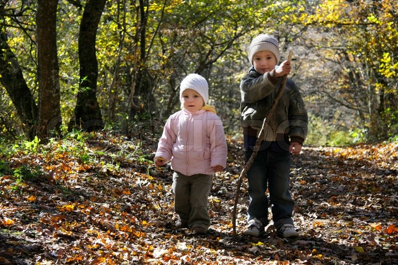 Two kids in autumn forest | Stock Photo | Colourbox