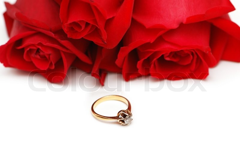 Three roses and ring isolated on the ... | Stock image | Colourbox
