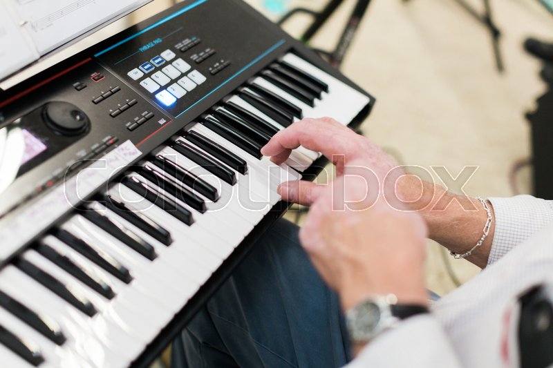 Keyboard player performing on stage ... | Stock image | Colourbox
