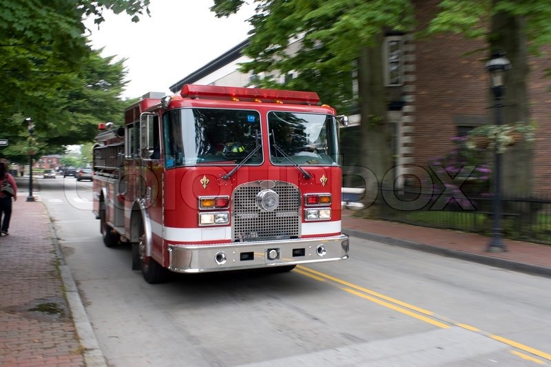 A fire engine speeding down the ... | Stock image | Colourbox