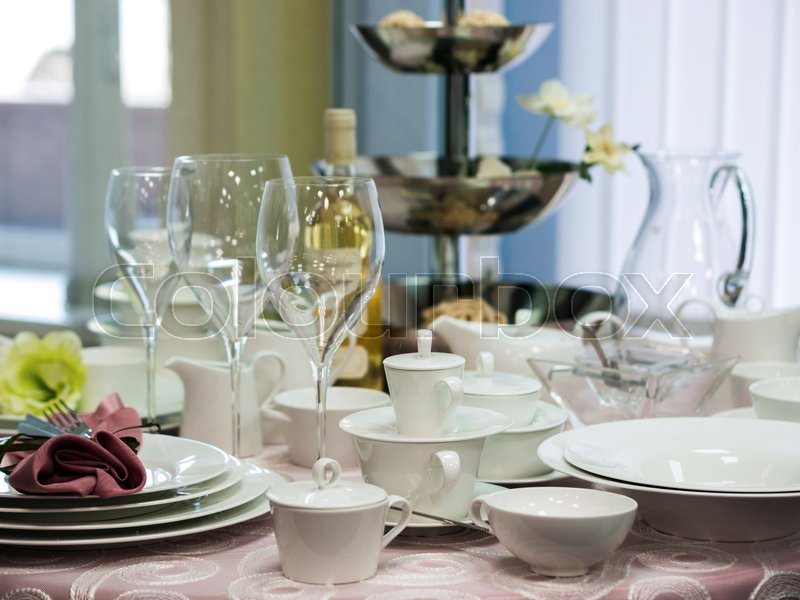 Set of new dishes on table with ... | Stock image | Colourbox