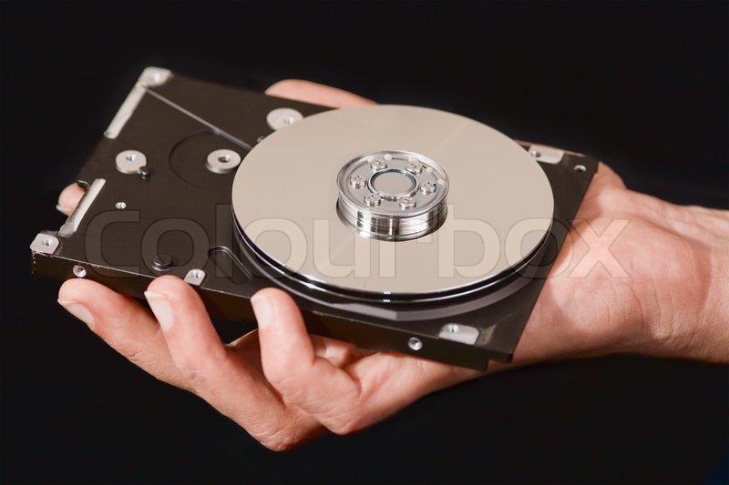Man's hand holding a hard drive taken ... | Stock image | Colourbox