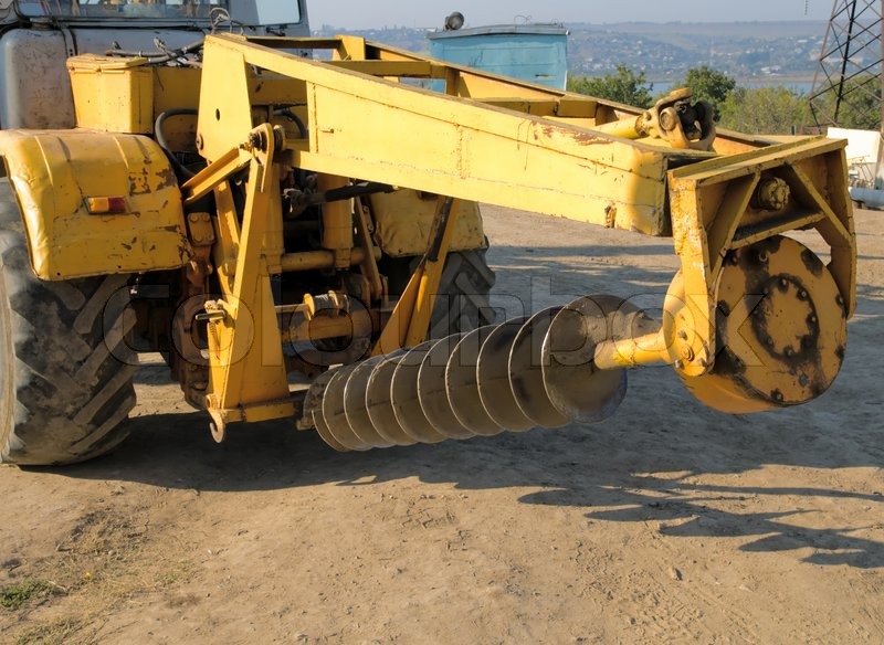 Augering machine yellow color | Stock image | Colourbox