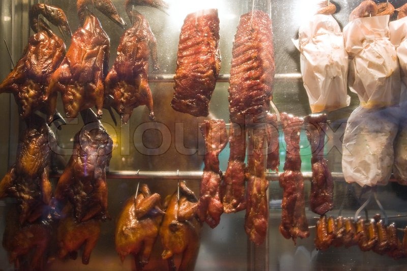 Freshly cooked meats on display in a ... | Stock image | Colourbox