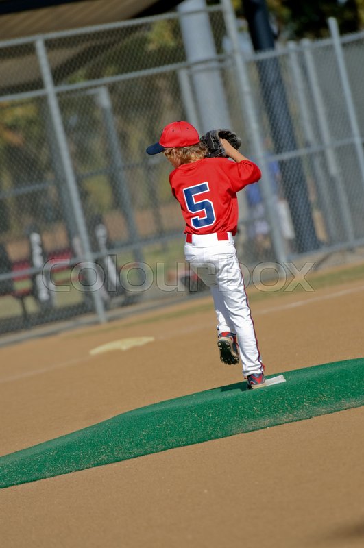 Youth baseball boy pitching on ... | Stock image | Colourbox