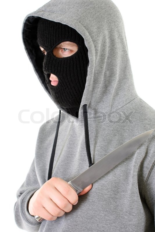 Gangster in black mask with knife | Stock Photo | Colourbox