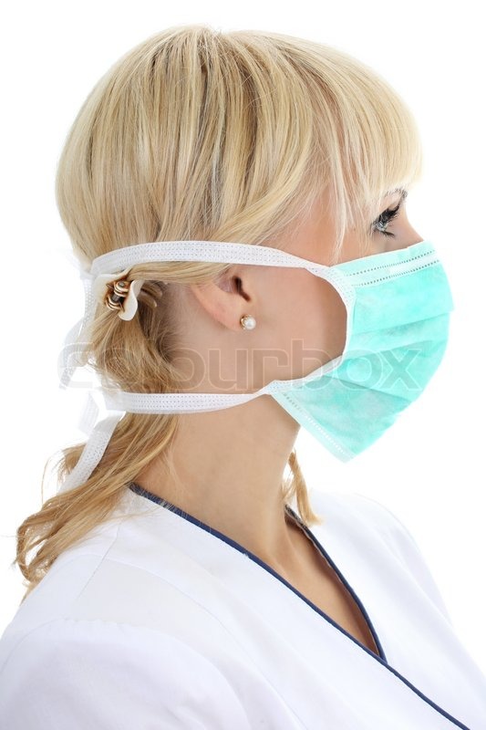 Attractive doctor woman in mask over ... | Stock image | Colourbox