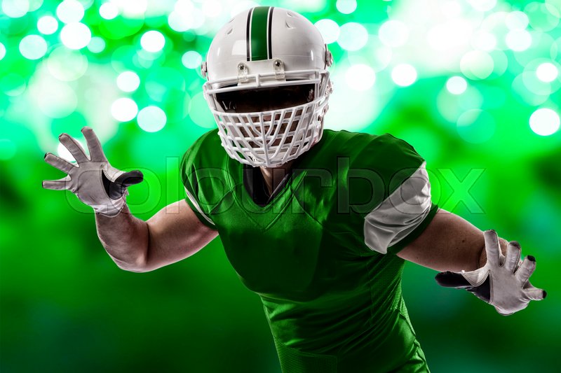 Football Player with a green uniform ... | Stock image | Colourbox
