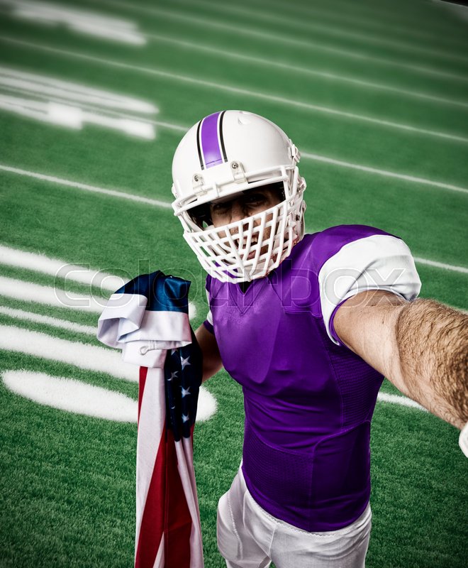 Football Player with a purple uniform ... | Stock image | Colourbox