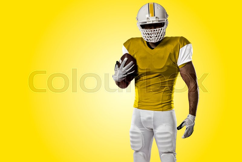 Football Player with a yellow uniform ... | Stock Photo | Colourbox