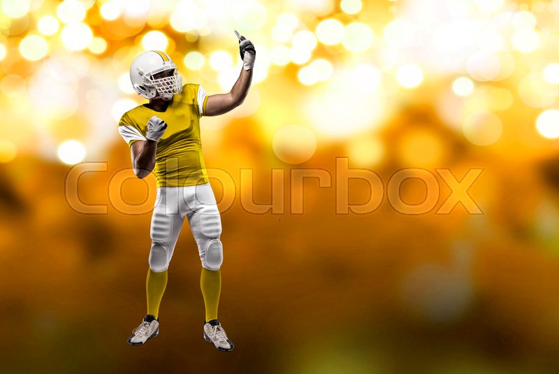 Football Player with a yellow uniform ... | Stock image | Colourbox