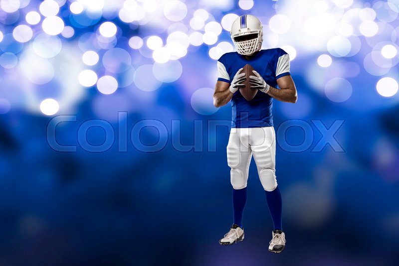 Football Player with a blue uniform on ... | Stock image | Colourbox