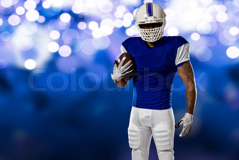 Football Player with a blue uniform on ... | Stock image | Colourbox