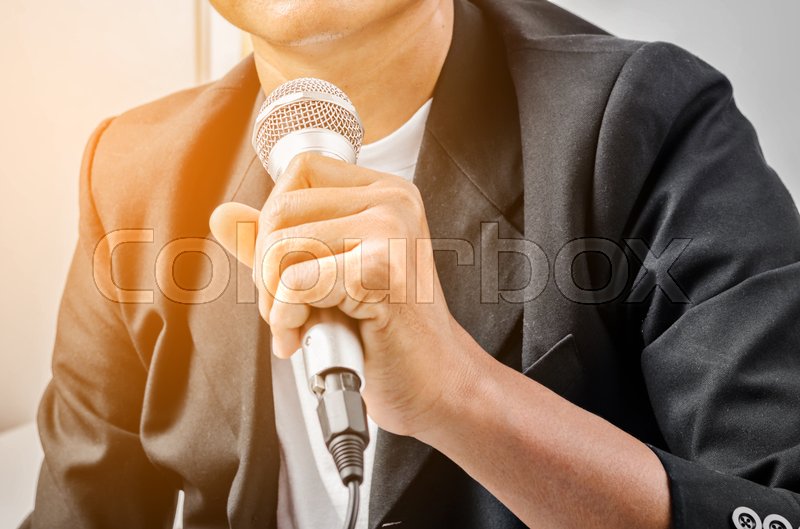 Businessman making speech with ... | Stock image | Colourbox