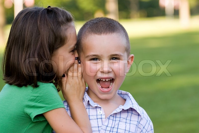 A young girl telling her brother a ... | Stock image | Colourbox