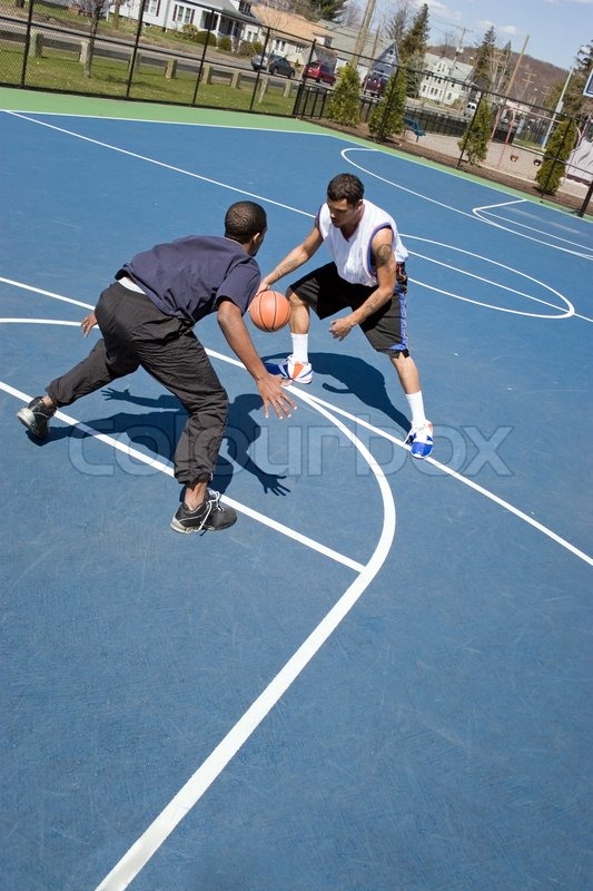 A young basketball player guarding his ... | Stock image | Colourbox