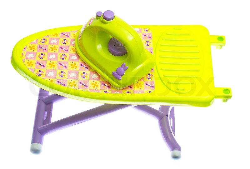 Toy iron and ironing board on white | Stock image | Colourbox