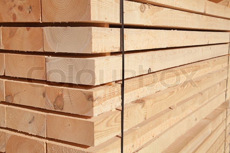 Stack of new wooden studs at the lumber ... | Stock image | Colourbox