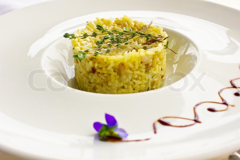Risotto served on white plate | Stock image | Colourbox