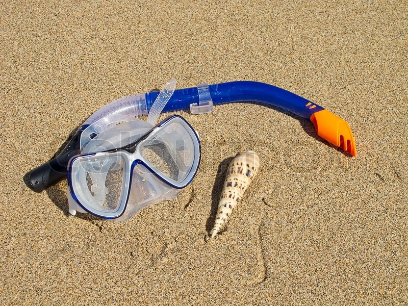 Snorkeling mask and shell on the beach | Stock image | Colourbox