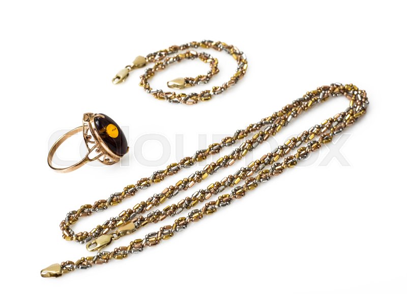 Gold jewelry on a white background. ... | Stock image | Colourbox