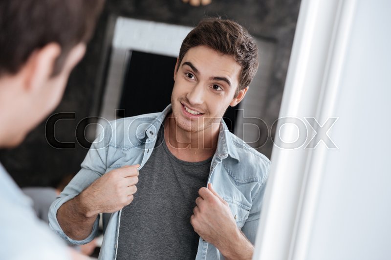 Person Looking In The Mirror Smiling