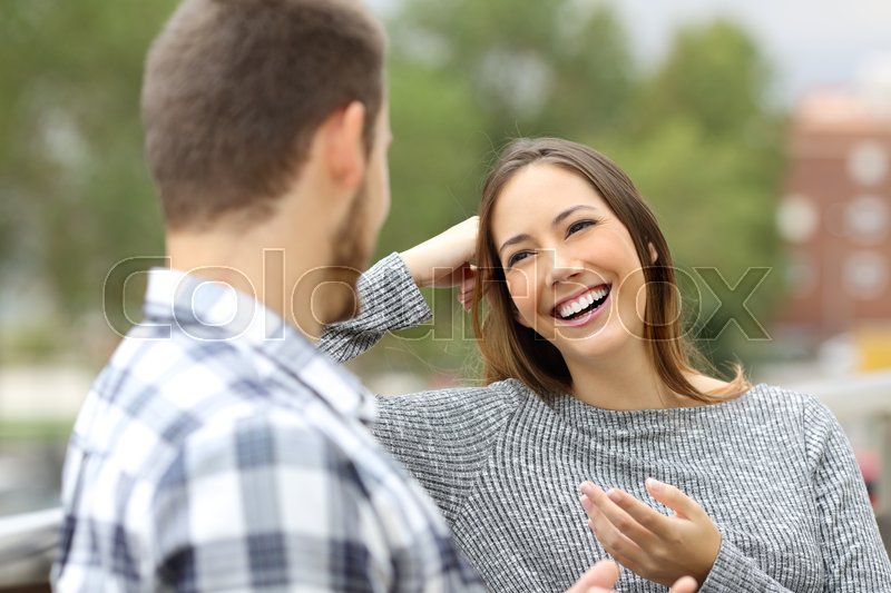 Happy casual couple talking looking ... | Stock image | Colourbox