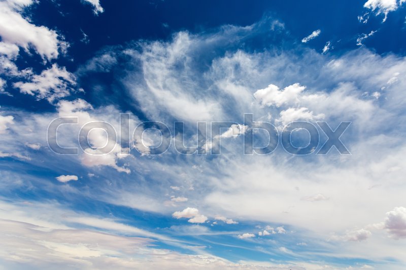 Cloudscape on deep blue sky. Background ... | Stock image | Colourbox