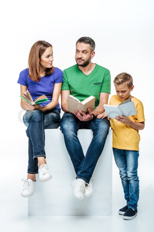 Happy family with one child reading ... | Stock image | Colourbox