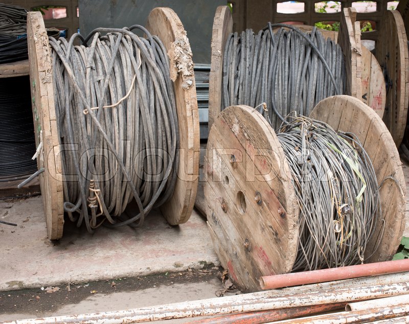 Old Wooden coil of electric cable on ... | Stock image | Colourbox