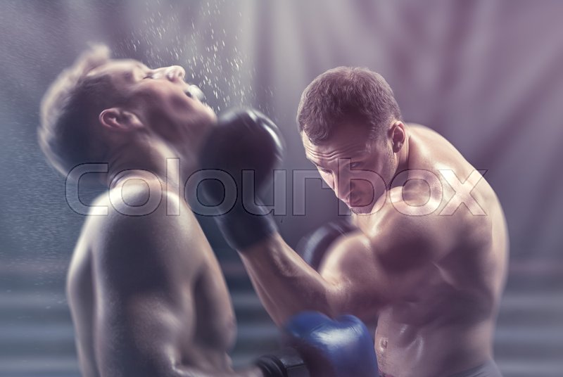 Two professional boxers fighting in the ... | Stock image | Colourbox