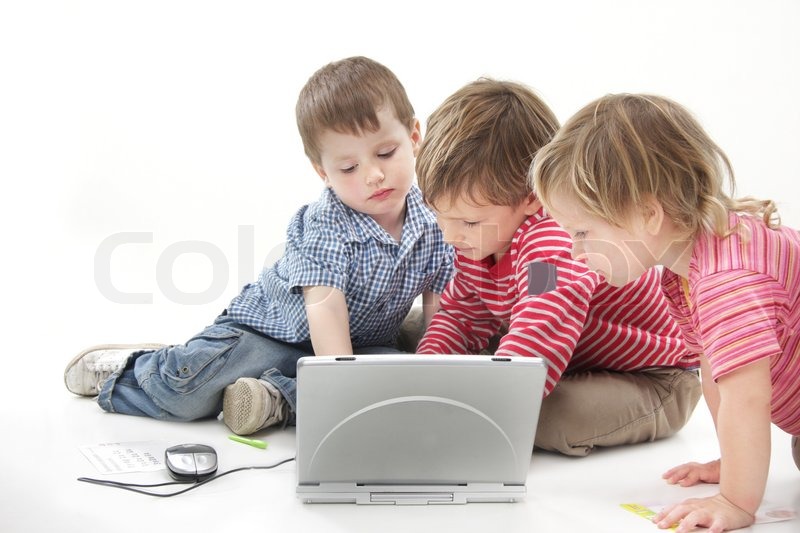 Group of children with laptop over ... | Stock image | Colourbox