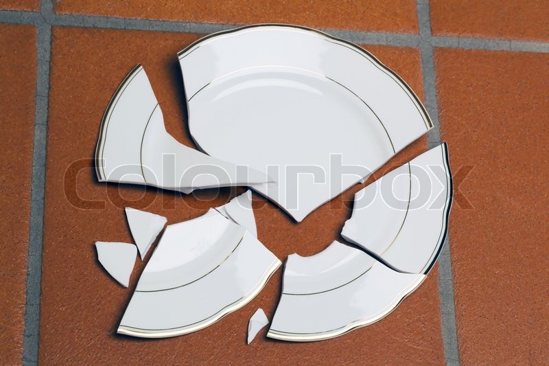 A broken plate lying on a floor ... | Stock image | Colourbox