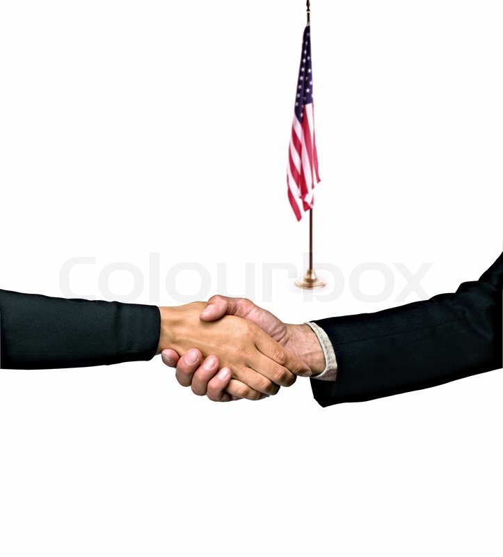 Hand shake and a American flag | Stock image | Colourbox