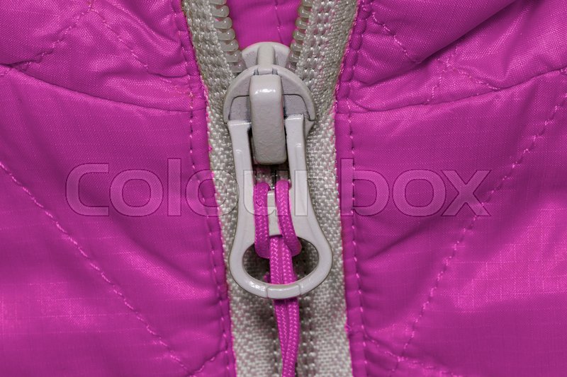 Closeup of a zipper on a pink winter ... | Stock image | Colourbox