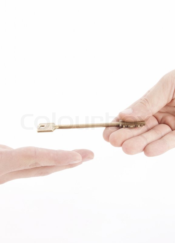 One hand giving keys to other isolated | Stock image | Colourbox
