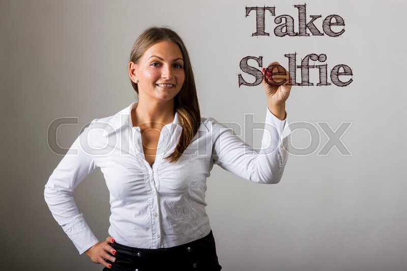Take Selfie - Beautiful girl writing on ... | Stock image | Colourbox
