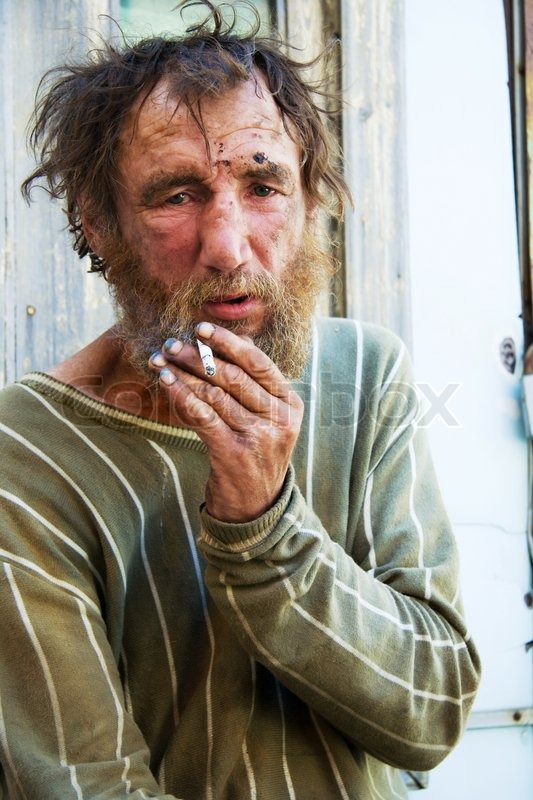Homeless man on a city street | Stock Photo | Colourbox