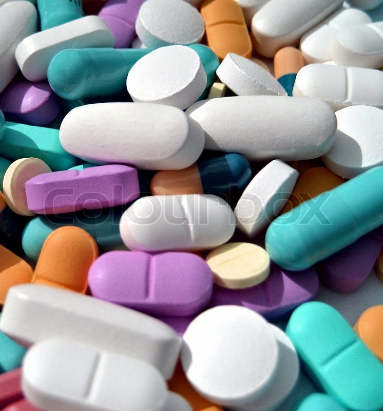 Tabletten bunten Hintergrund und kann ... | Stock Bild | Colourbox