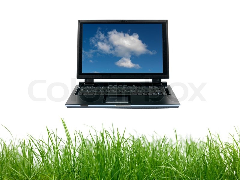 A laptop floating above green grass ... | Stock Photo | Colourbox