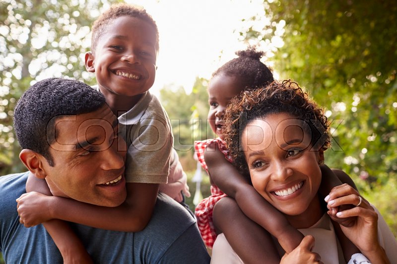 African American parents giving ... | Stock image | Colourbox