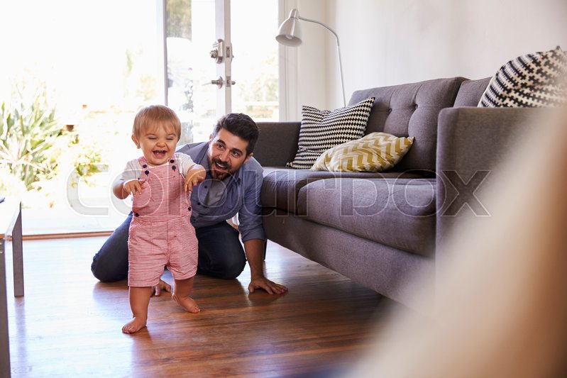 Parents Watching Baby Daughter Take ... | Stock image | Colourbox